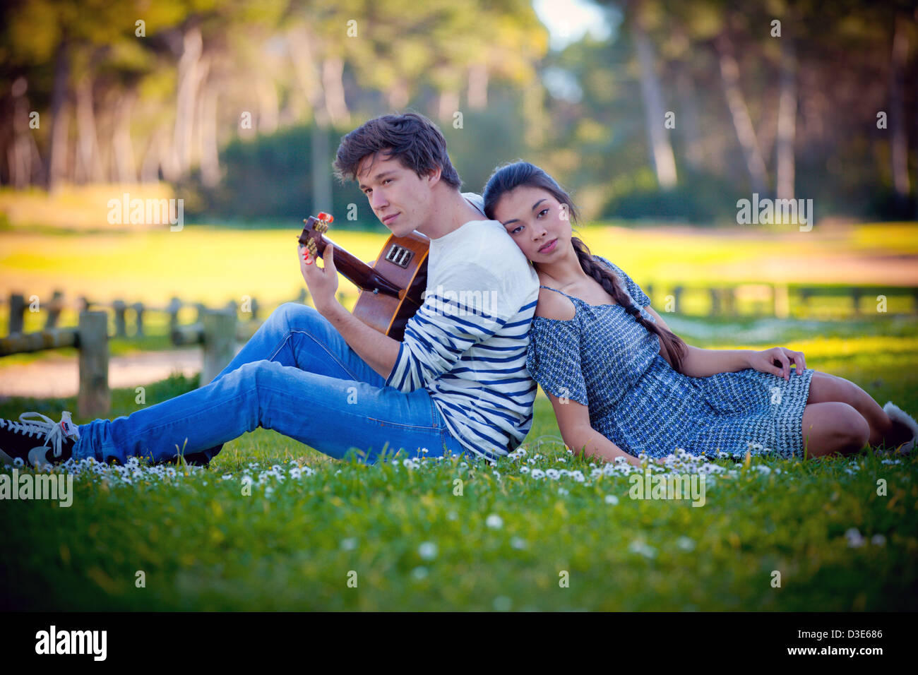romantic couple in love playing guitar Stock Photo - Alamy