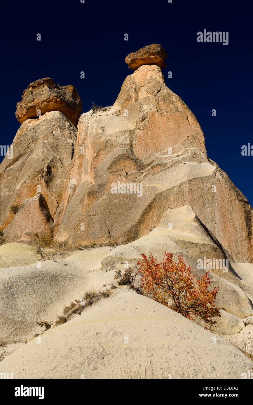 Two Fairy Chimneys with sphynx on the left behind Three Sisters hoodoos ...