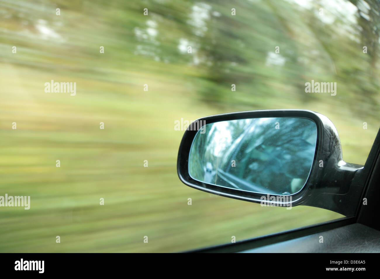 car on the road with motion blur background and rear view mirror Stock ...