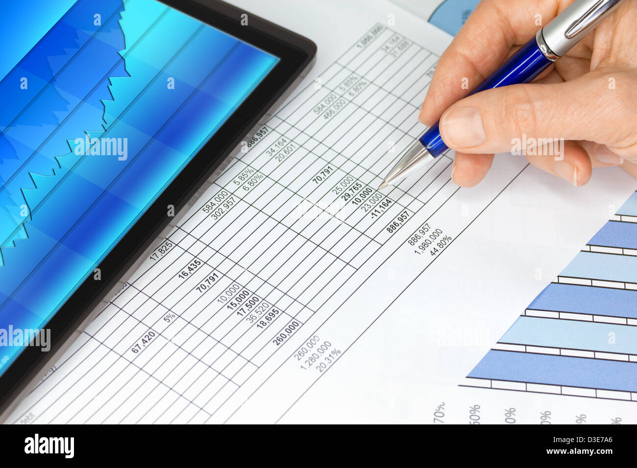 Tablet Computer with Hand Pen Figures and Graphs Stock Photo - Alamy