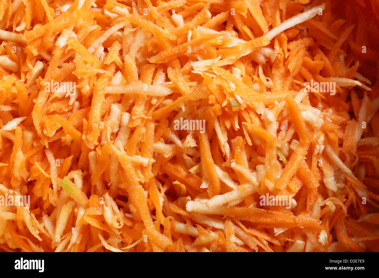 Close up grated carrots vegetables salad as background Stock Photo - Alamy