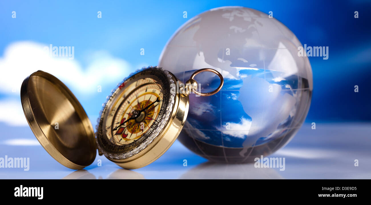 Compass, globe and sky Stock Photo - Alamy