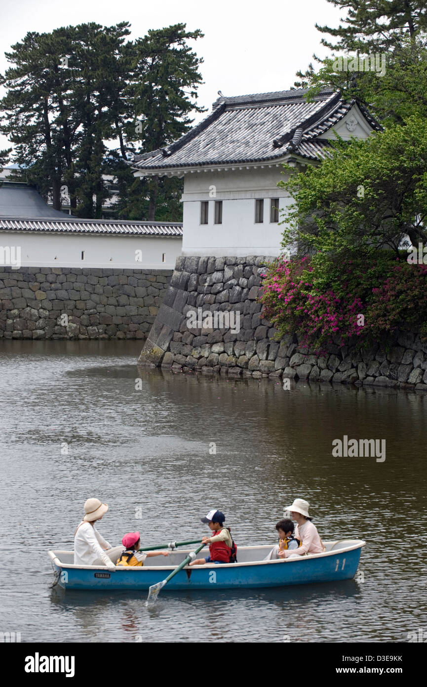 Two mothers and their children navigate historic Odawara Castle moat ...
