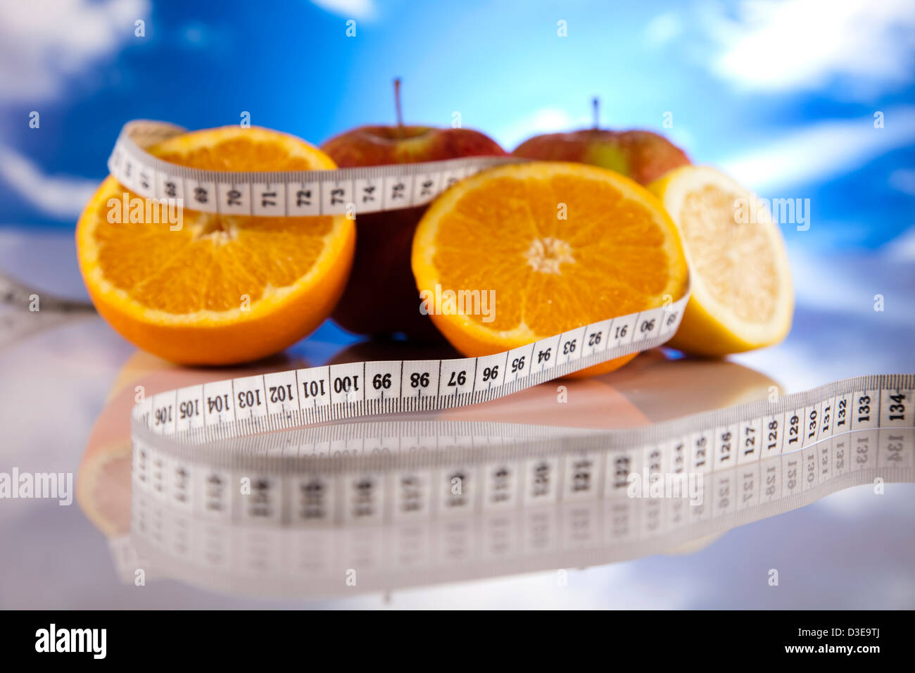 Fruits with measuring of dumbbell Stock Photo - Alamy