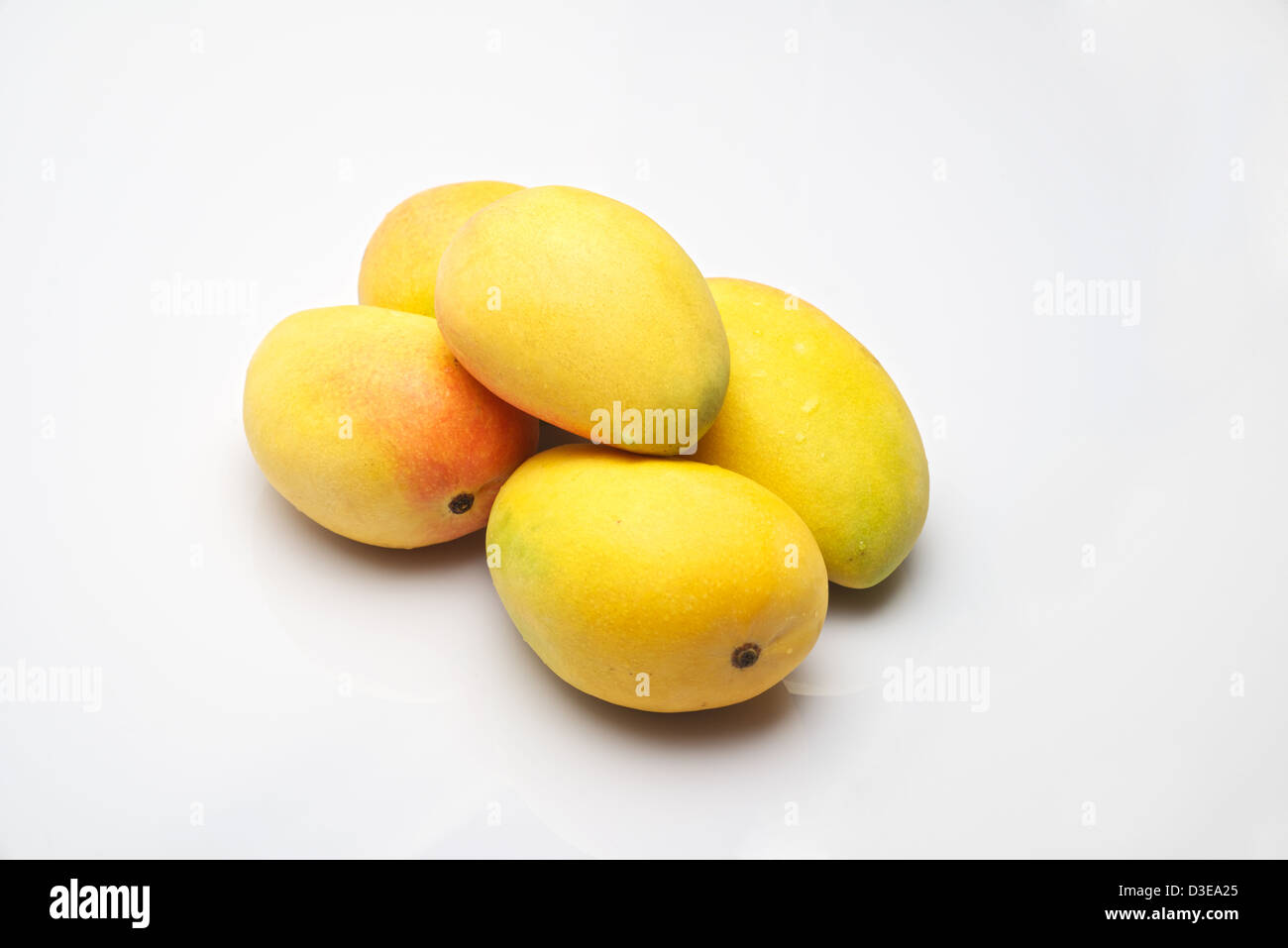 Mangos on white background Stock Photo - Alamy