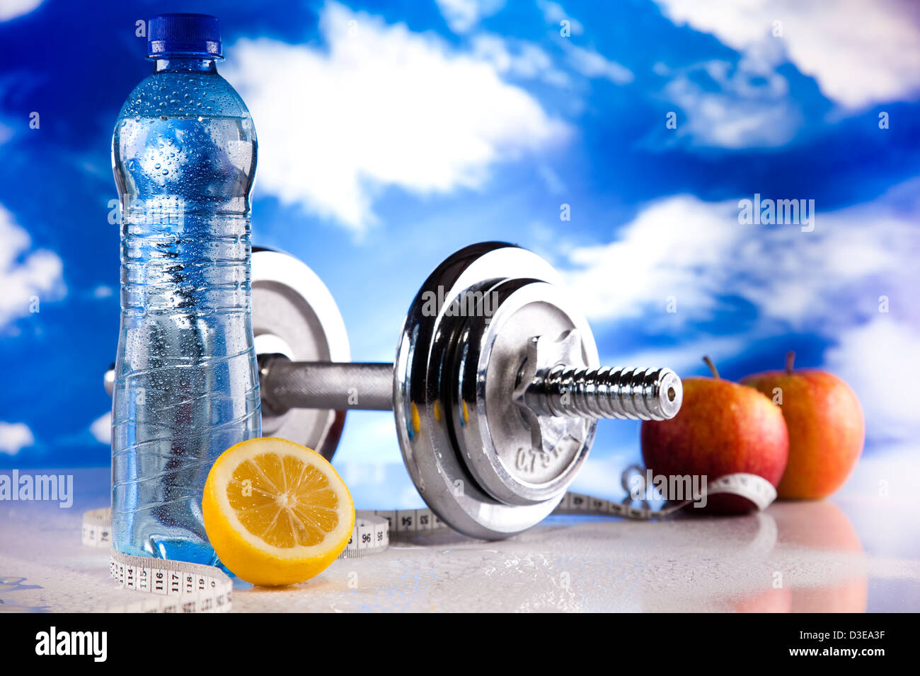 Fruits with measuring of dumbbell Stock Photo - Alamy
