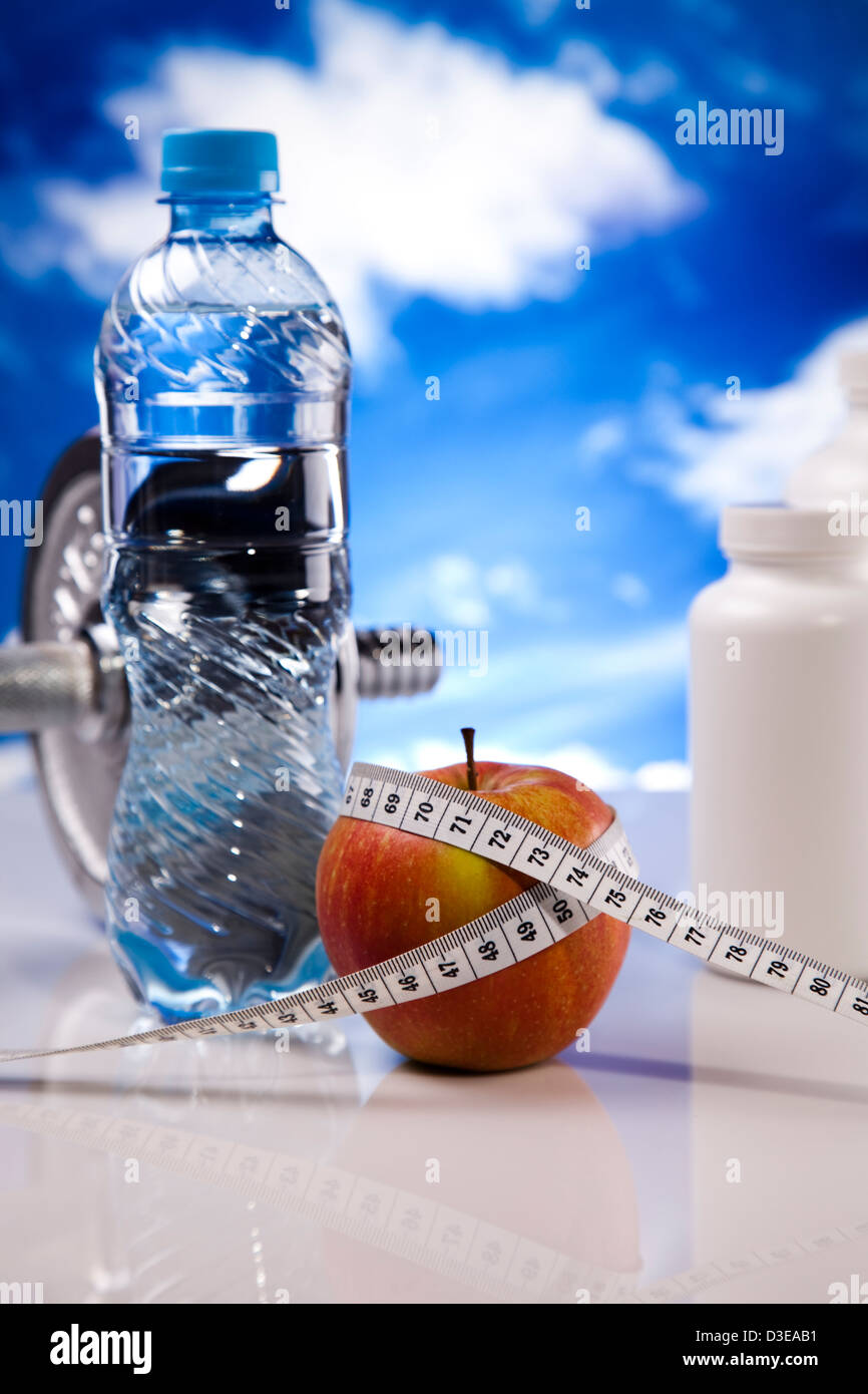 Fruits with measuring of dumbbell Stock Photo - Alamy