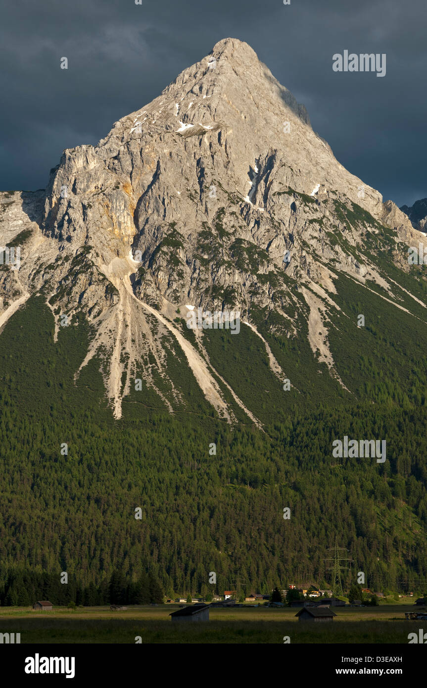 The peak Ehrwalder Sonnenspitze in the eerie light of an approaching ...