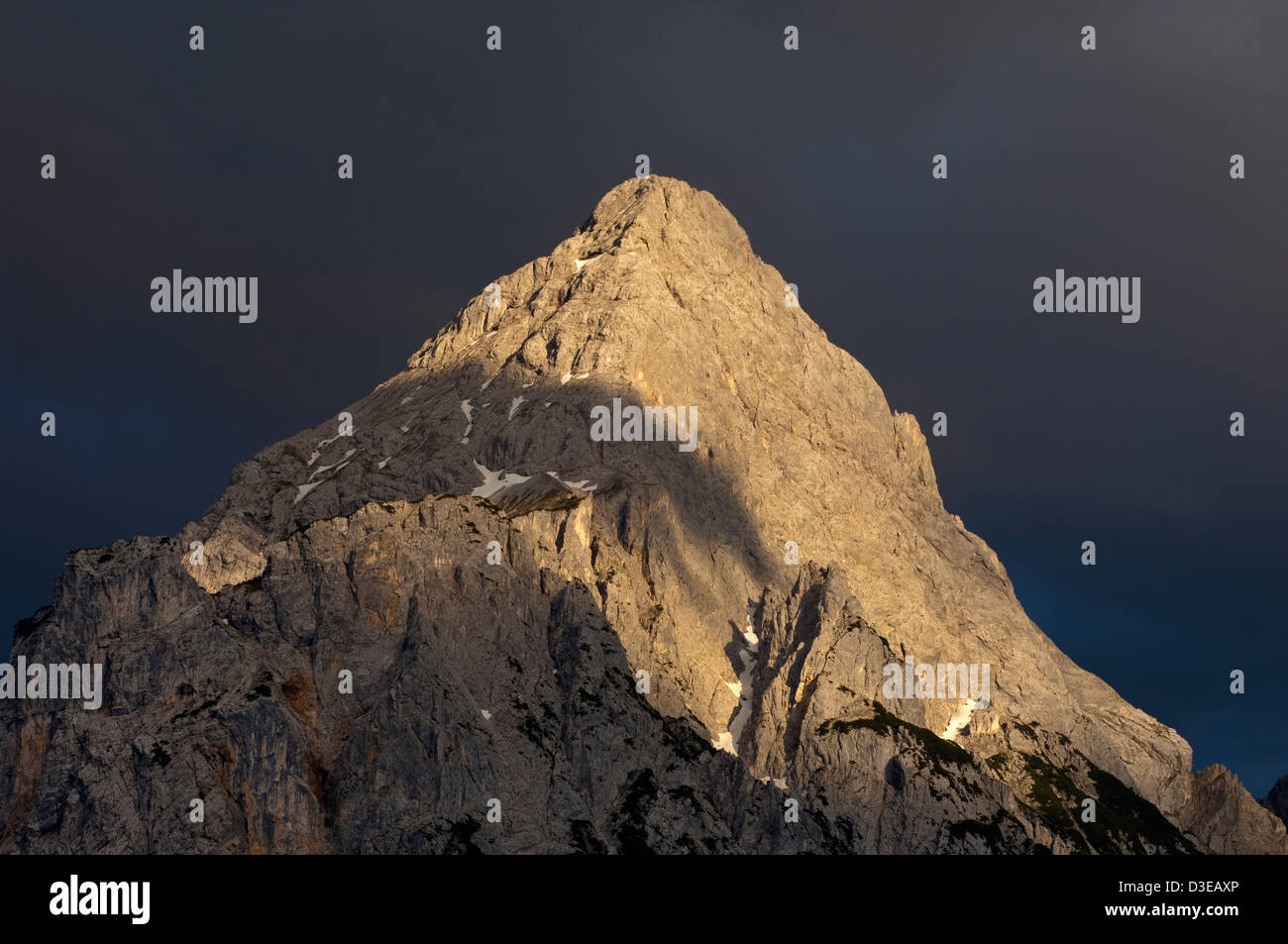 Peak Ehrwalder Sonnenspitze in the eerie light of an approaching ...
