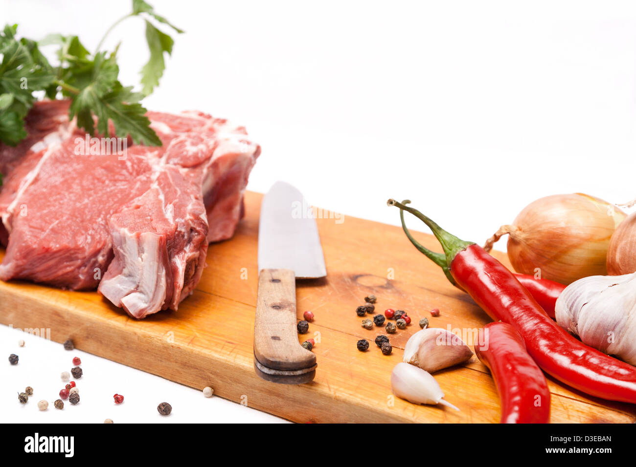 fresh meat of beef with bone on wooden with spices and knife Stock ...