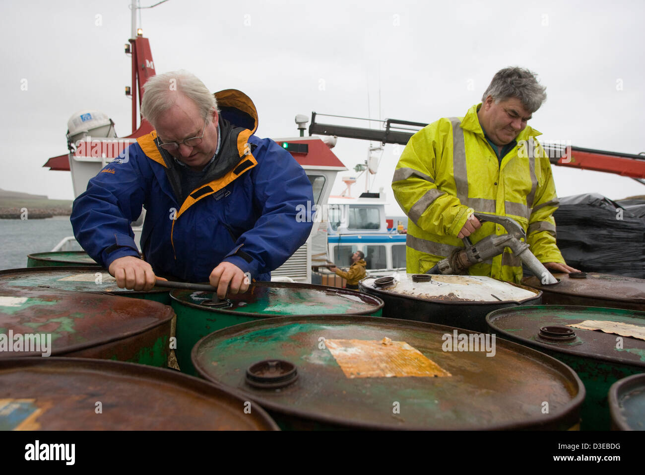 ISLAND OF EIGG, SCOTLAND - 31st OCTOBER 2007: Islanders fill 45 gallon ...