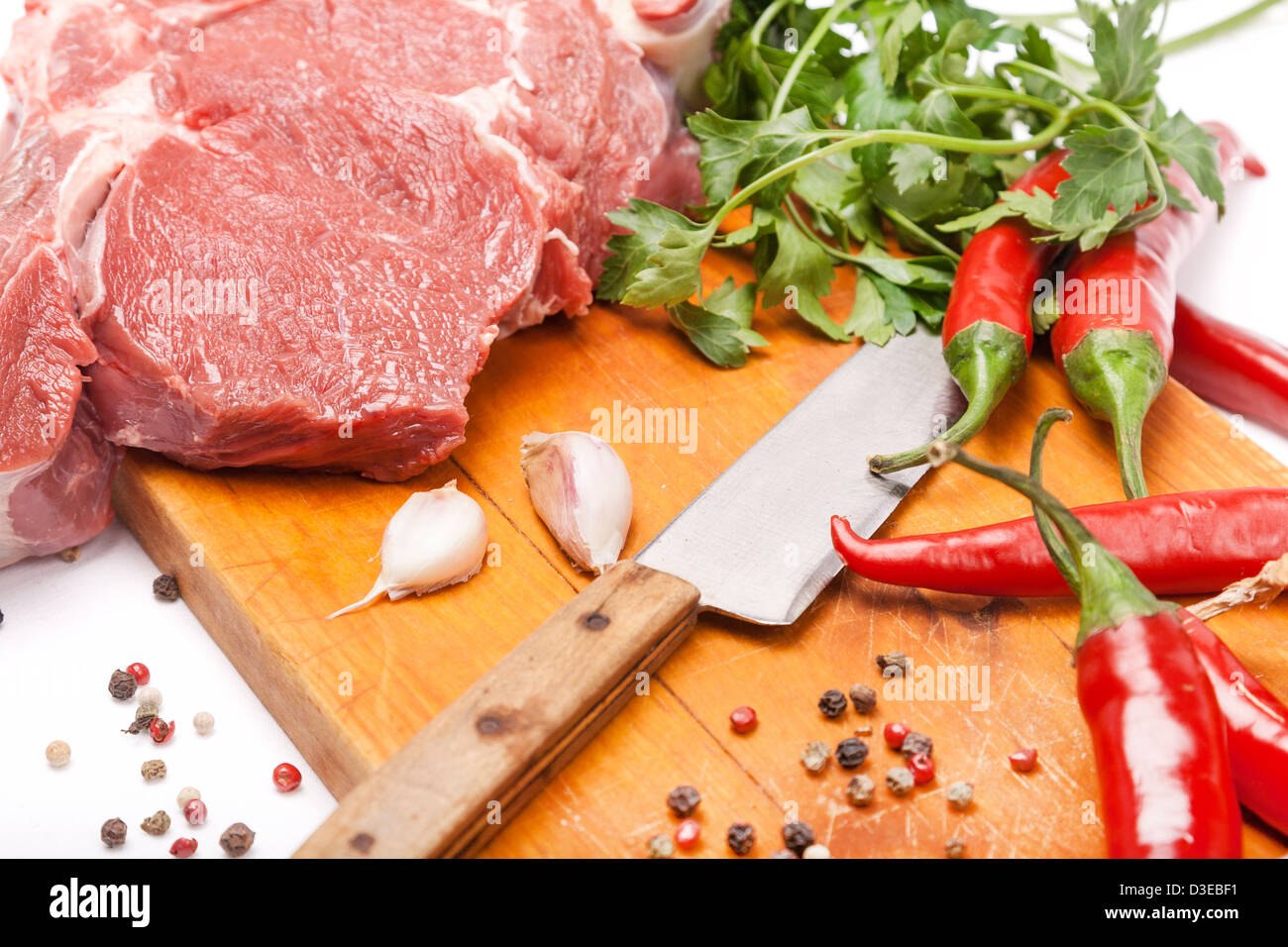 fresh meat of beef with bone on wooden with spices and knife Stock ...