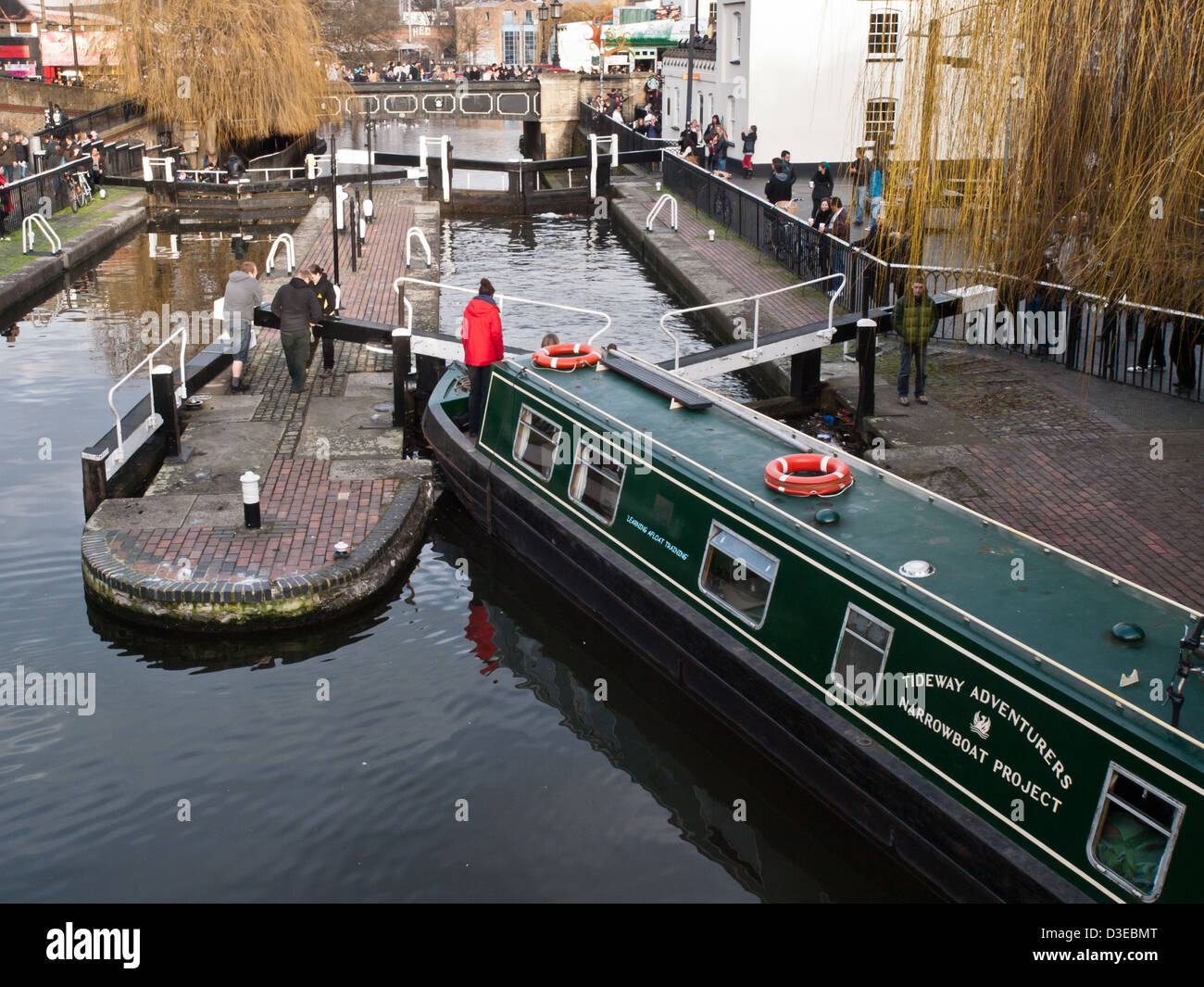 A narrowboat negotiates Camden Lock on the Regent's Canal, through ...