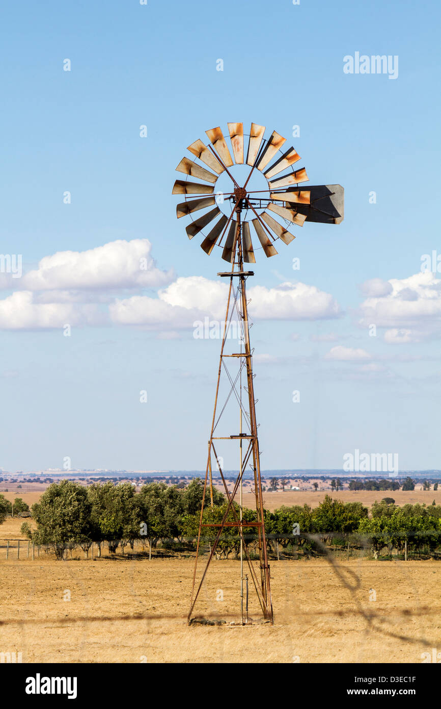 Close view of an old water pumping windmill on a dry land Stock Photo ...
