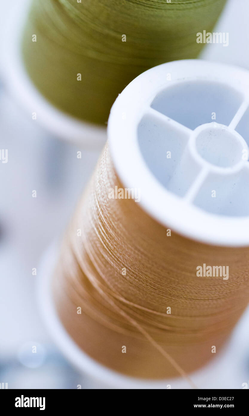 Colorful spools of thread on the wall in tailor shop Stock Photo - Alamy