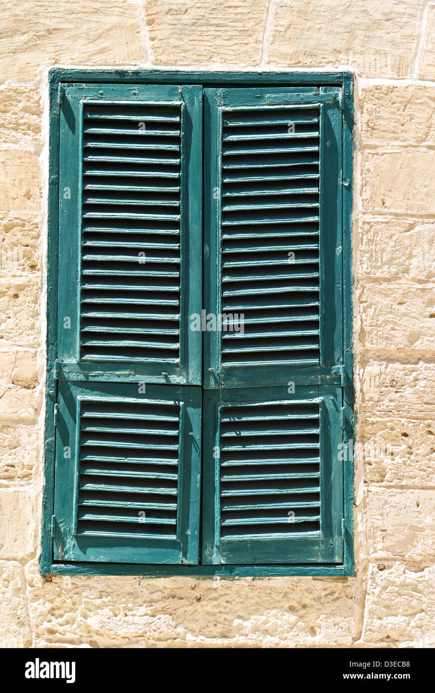 Green rustic window shutters set in stone wall Stock Photo - Alamy