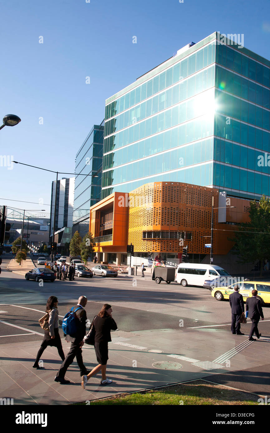 Businessmen and women crossing at traffic lights on Collins Street ...