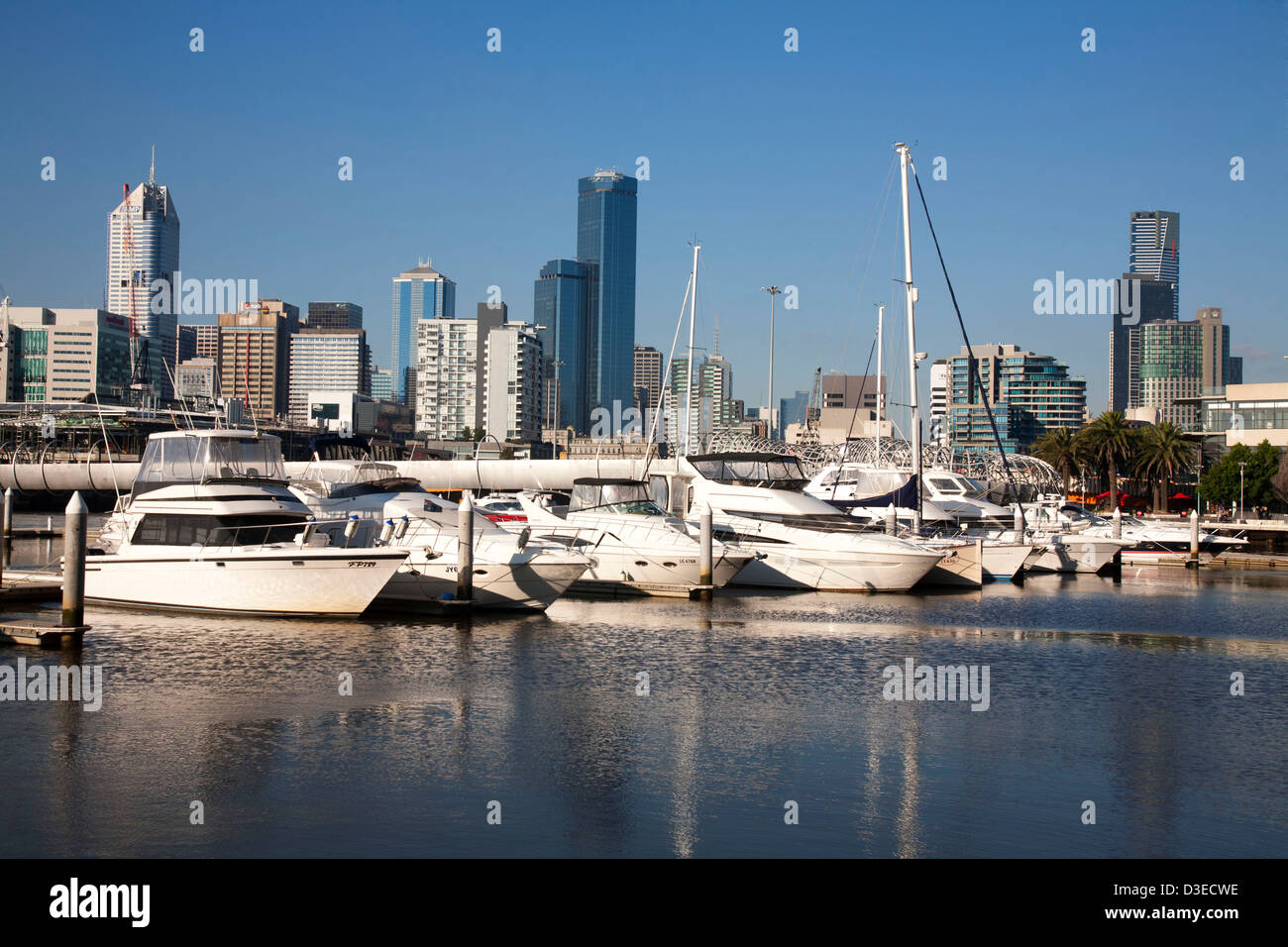 Luxury yachts and motor boats berthed at the Marina Victoria Harbour ...