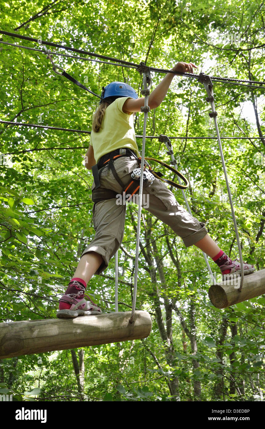 Girl at the rope course Stock Photo - Alamy
