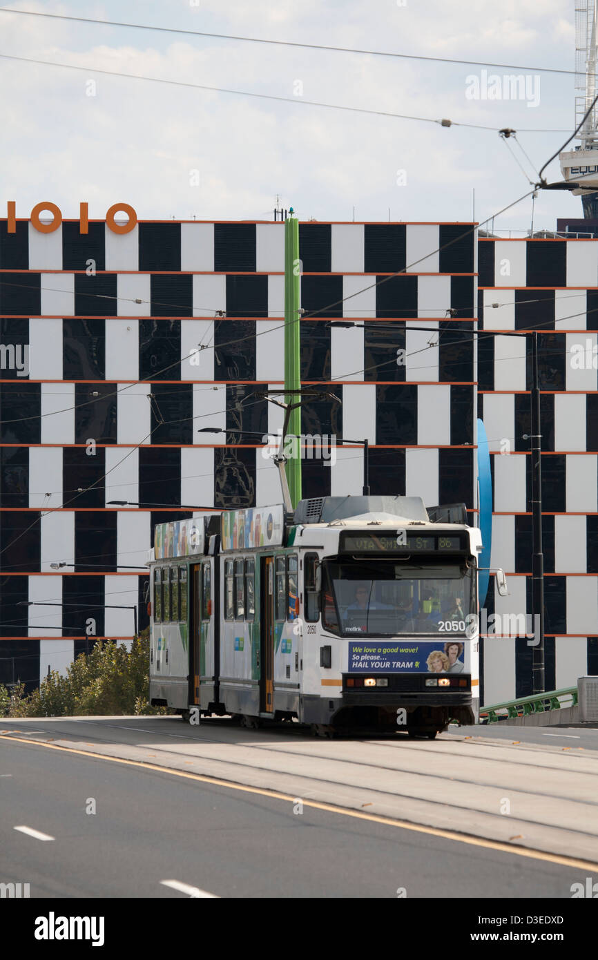 Melbourne city tram passing in front of the striking visual facade of ...