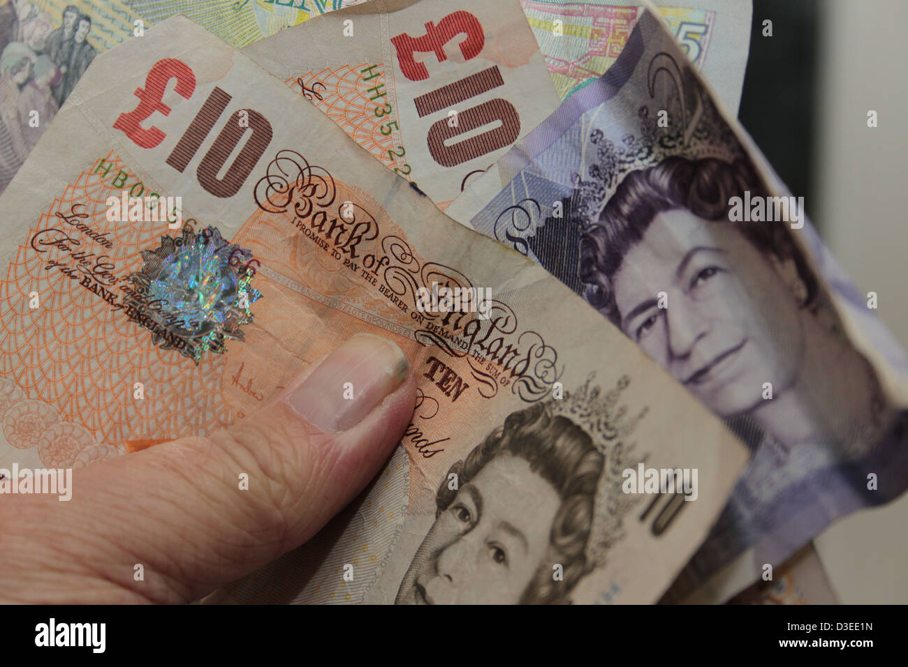 20 pound notes and hand hi-res stock photography and images - Alamy