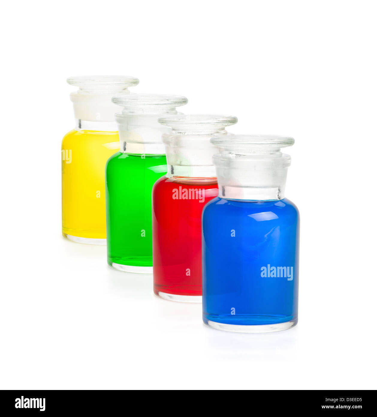 Four laboratory bottles filled with colorful liquids Stock Photo - Alamy