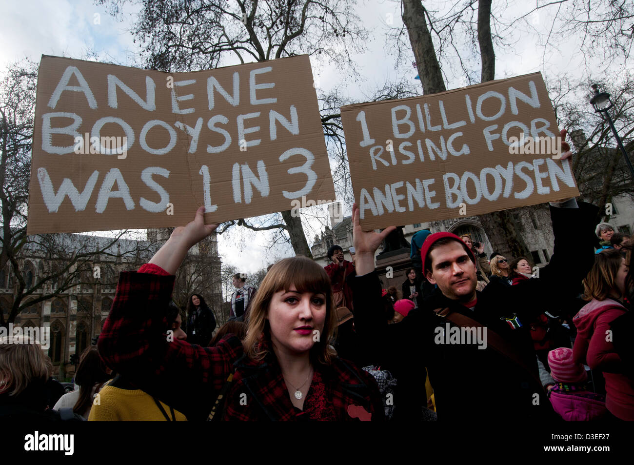 Two South Africans hold a placard with the name of Anene Booysen. 17 ...