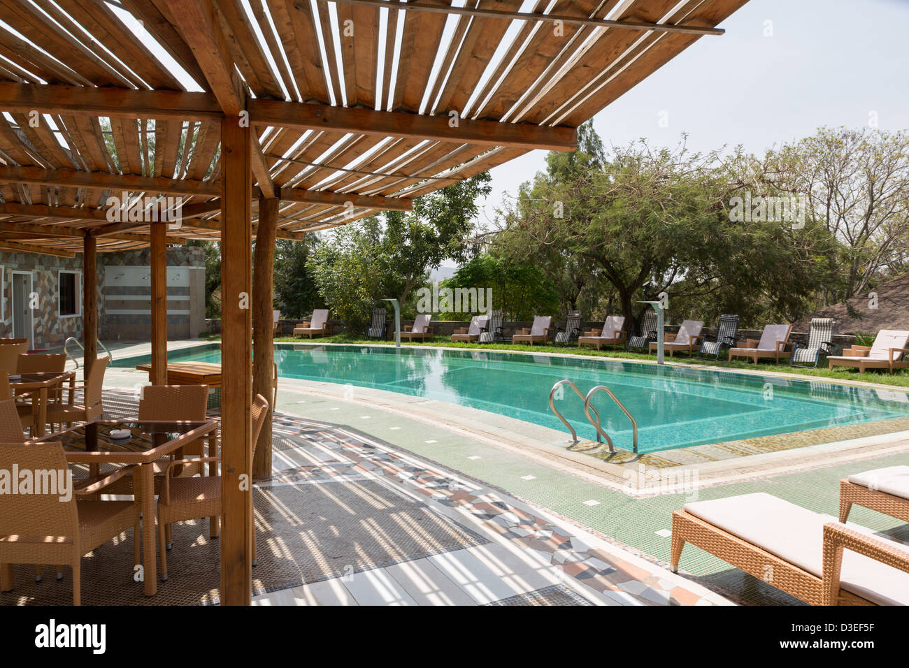 swimming pool in a beautiful setting at Adulala resort Stock Photo - Alamy