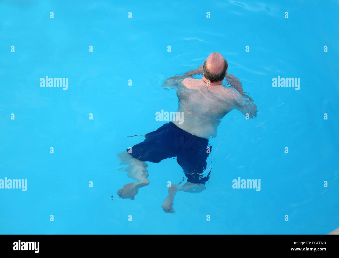 BALD MAN SWIMMING IN POOL Stock Photo - Alamy