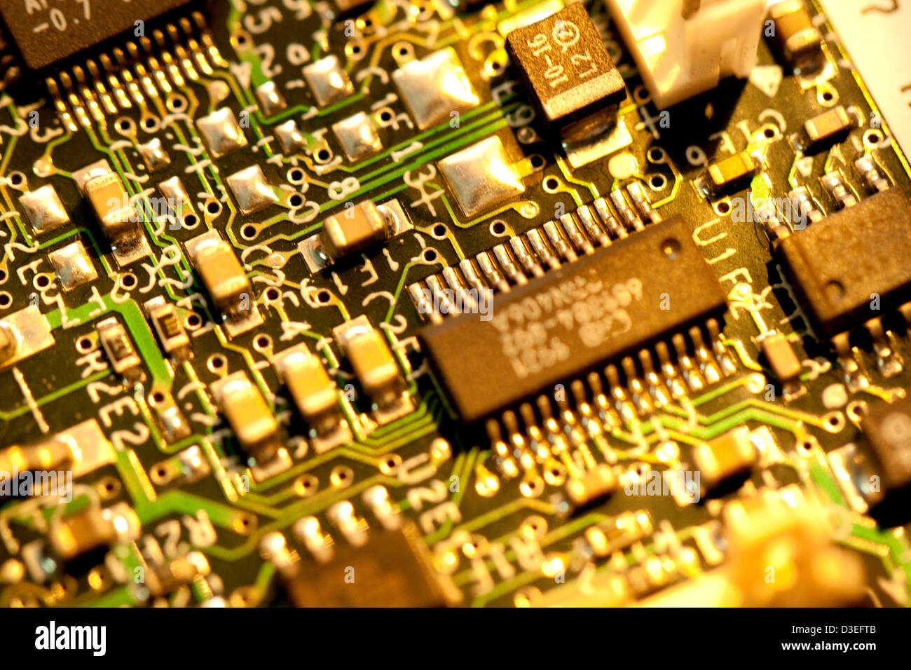 Close View Detail Of Computer Circuit Chips On A Golden Light Stock 