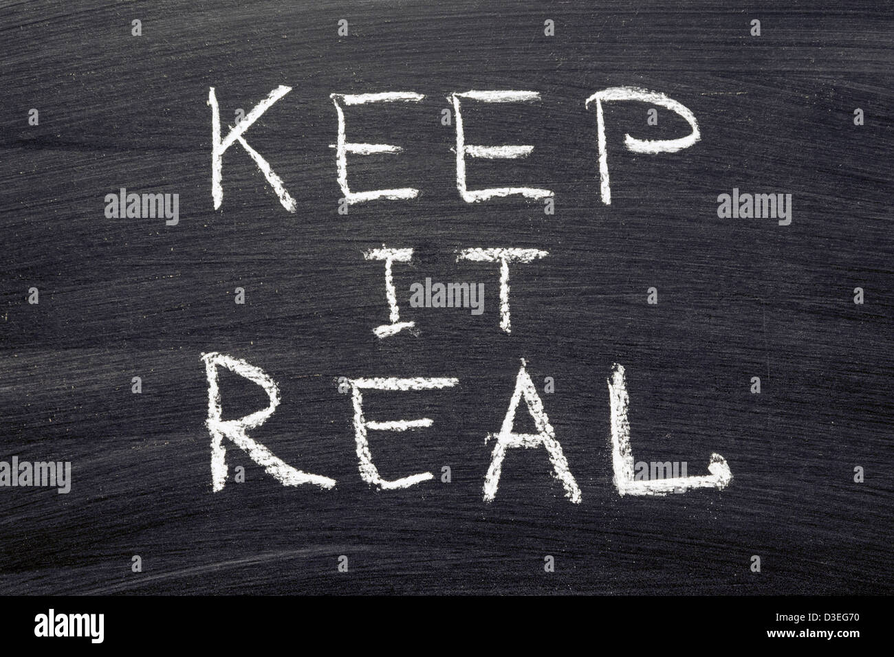 keep it real phrase handwritten on blackboard Stock Photo - Alamy