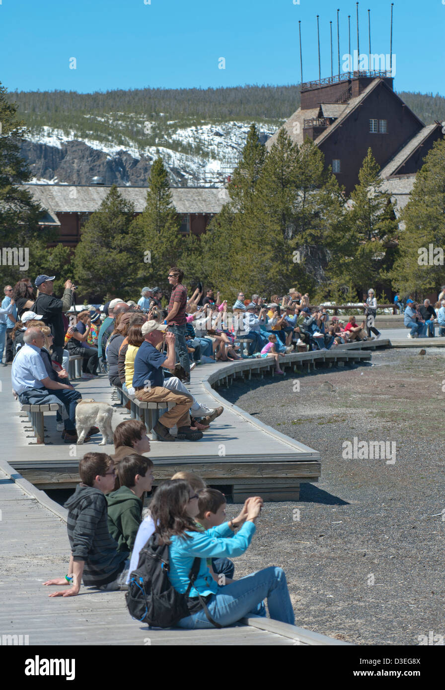 Visitors gather to watch the eruption of Old Faithful Geyser, one of ...