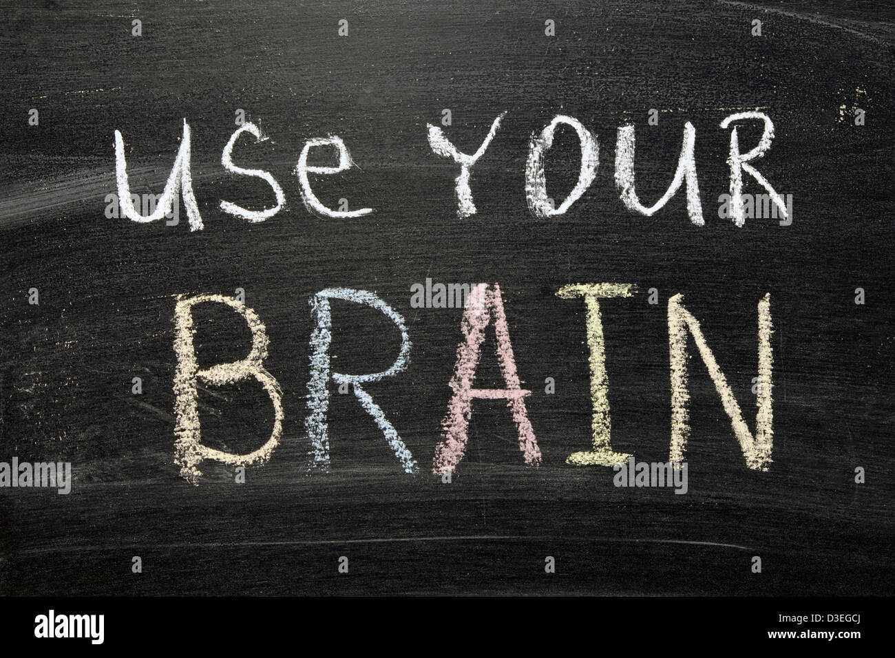 use your brain phrase handwritten on blackboard Stock Photo - Alamy
