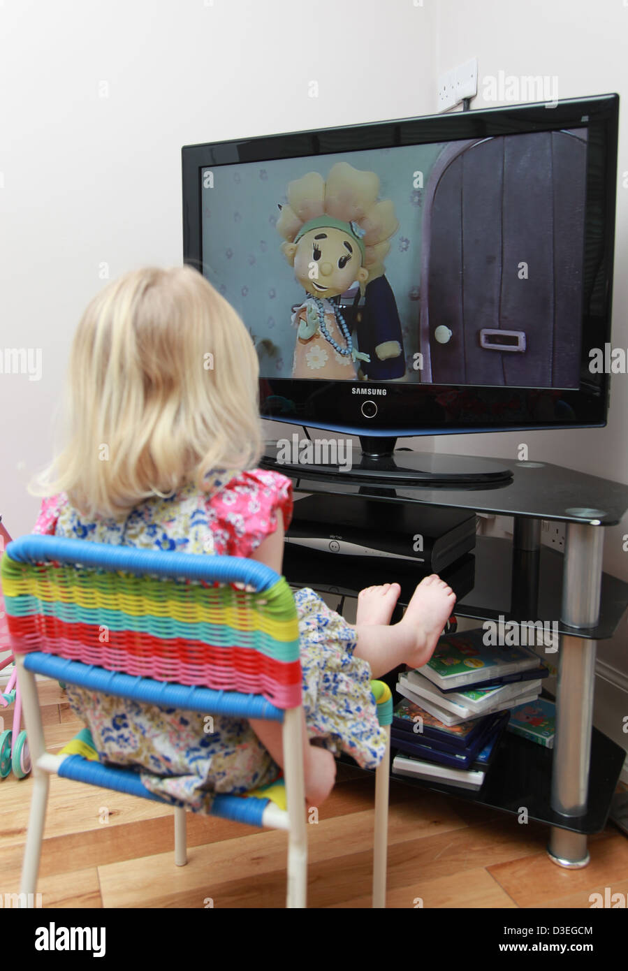 Toddler watching television Stock Photo - Alamy