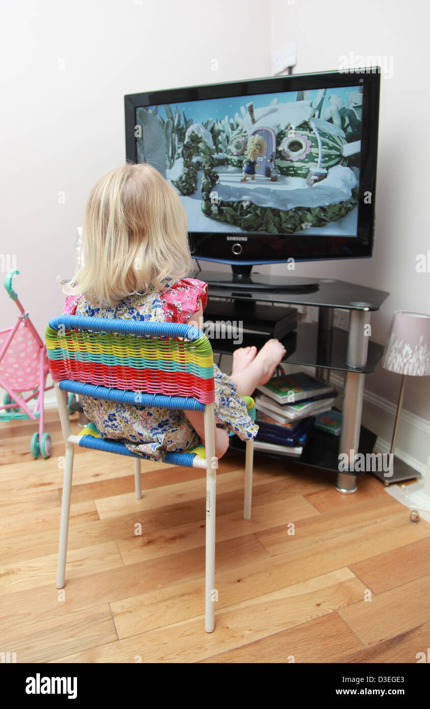 Toddler watching television Stock Photo - Alamy