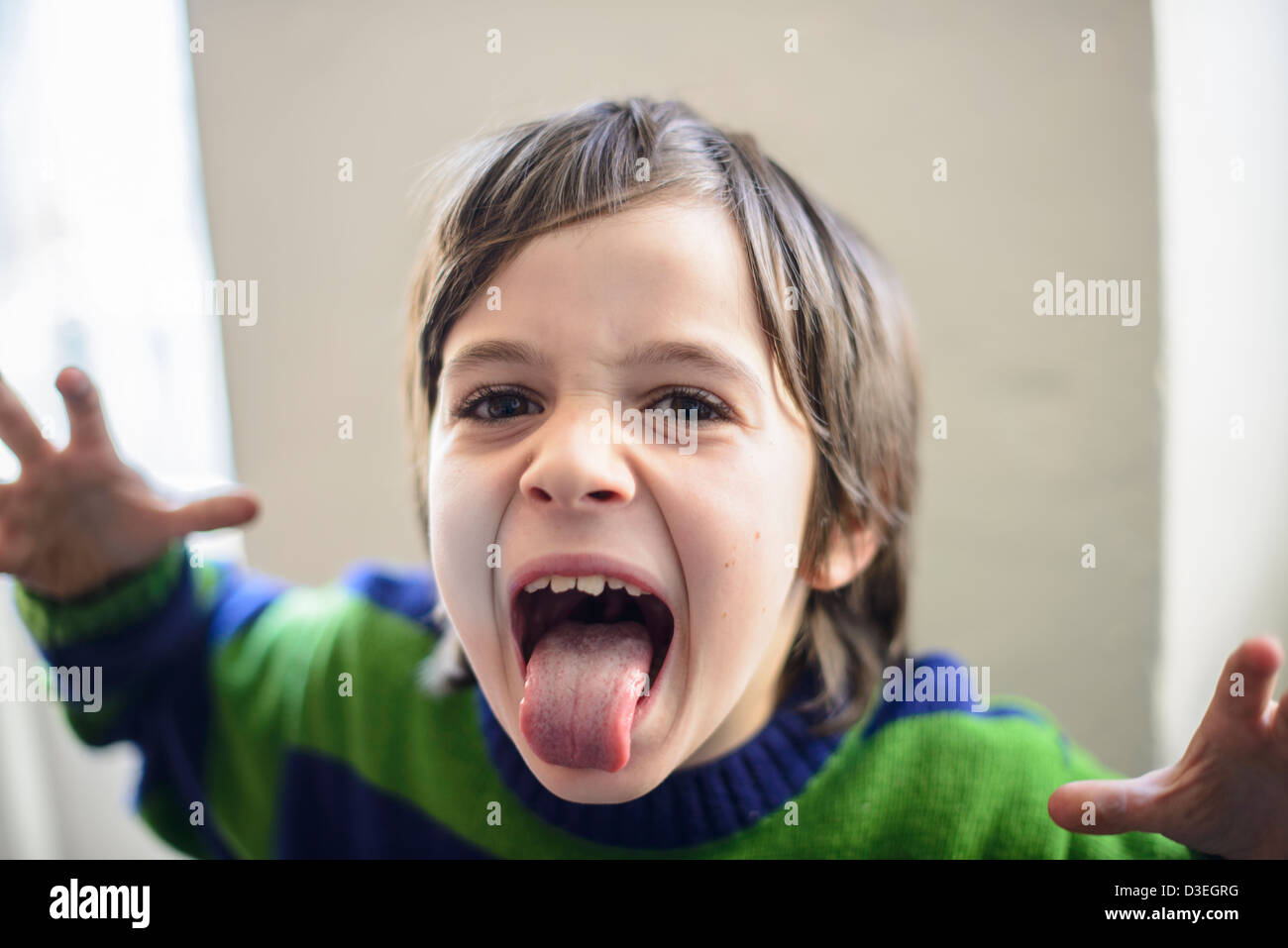 child makes grimaces Stock Photo - Alamy