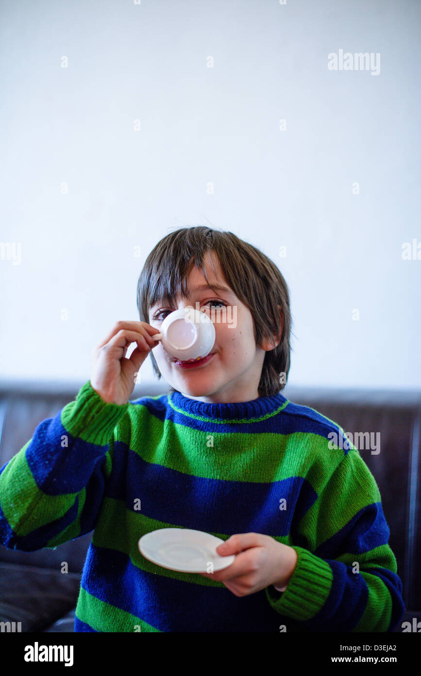 child is drinking from the cup Stock Photo - Alamy