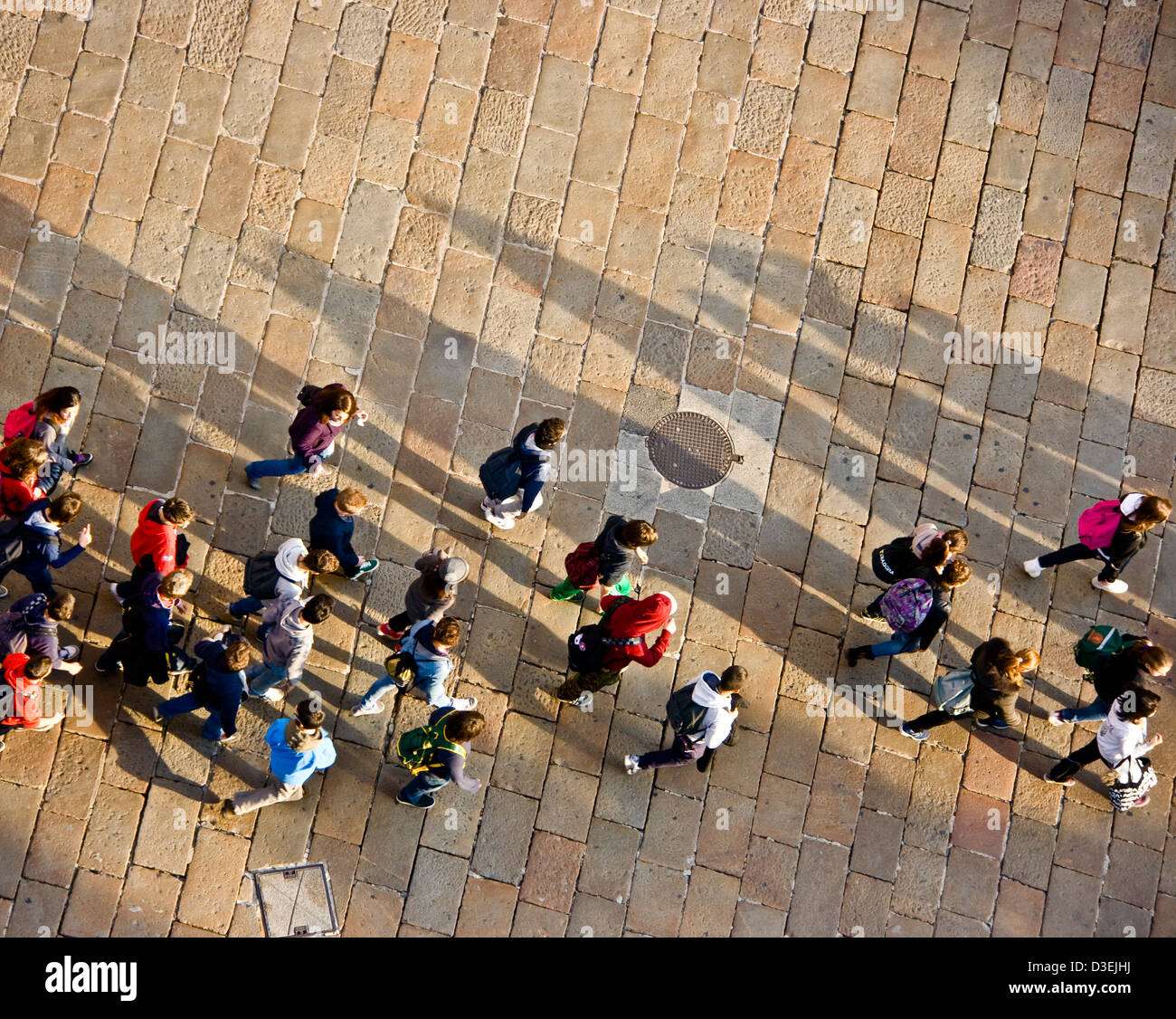 Group of young tourists walking through pedestrianized zone central ...