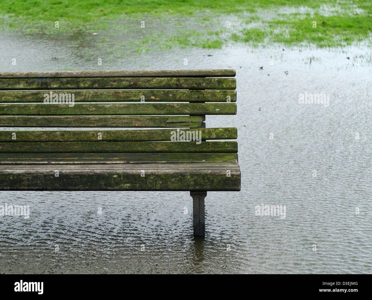 seat or bench in flooded park Stock Photo - Alamy