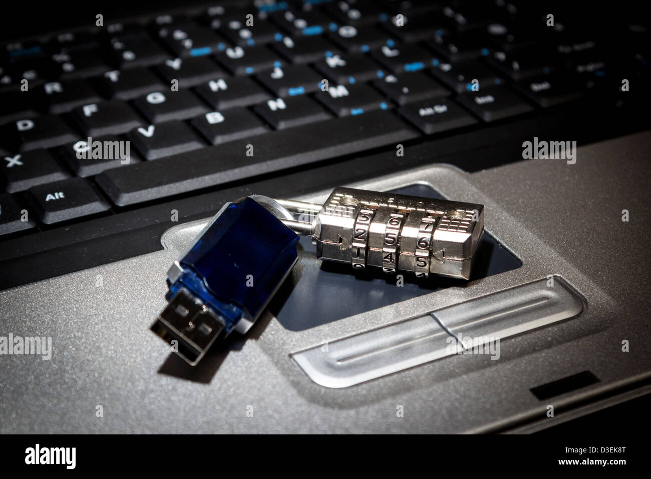 USB Flash drive padlocked with a combination lock highlighting data ...