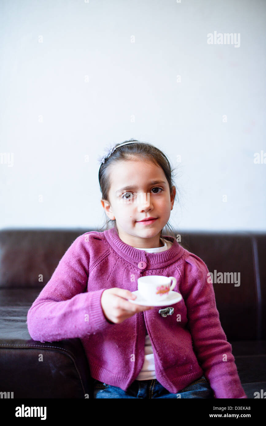 child is drinking from the cup Stock Photo - Alamy