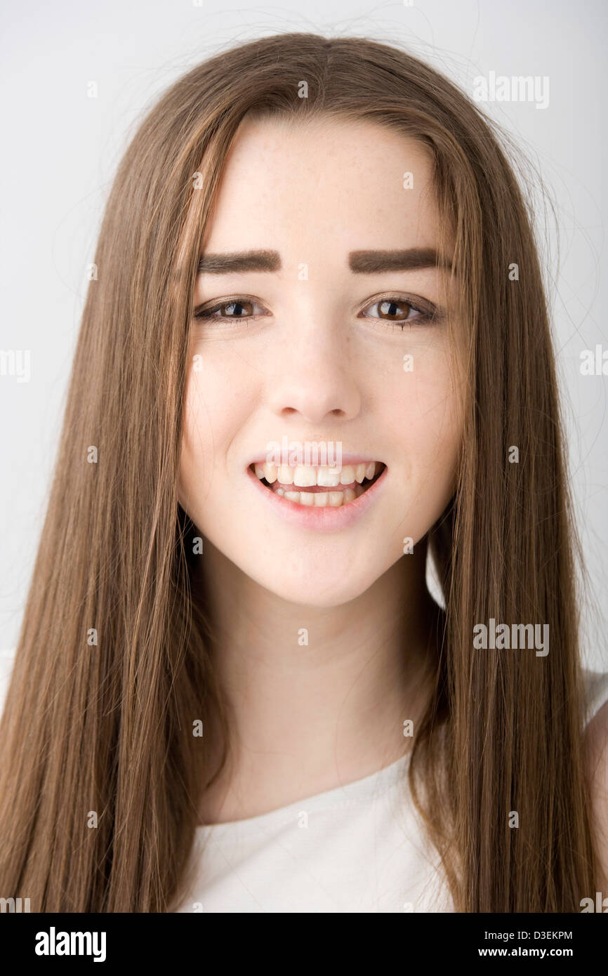 Portrait of teenage girl with long brown hair Stock Photo - Alamy