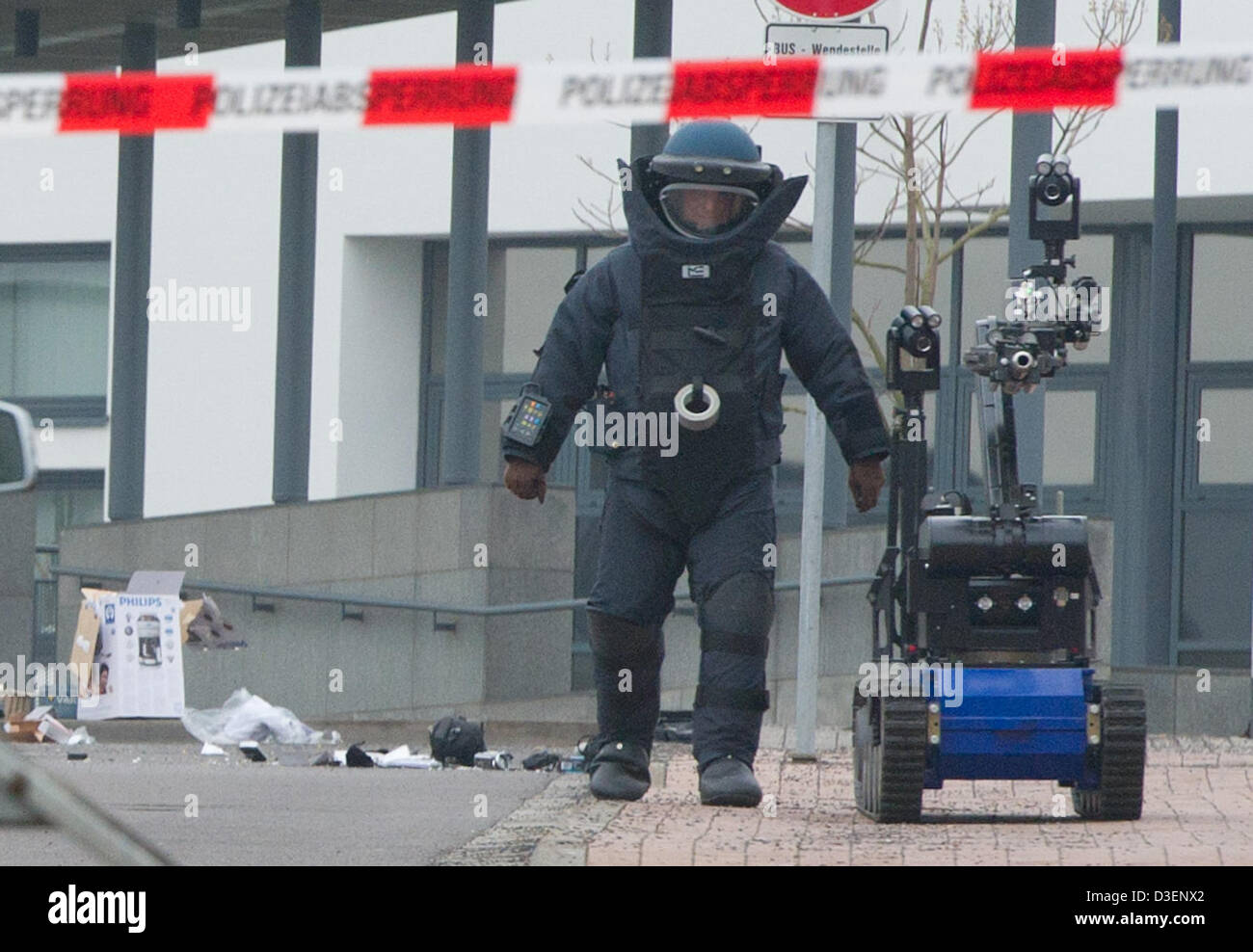 An officer from the improvised explosive device (IED) command kneels ...