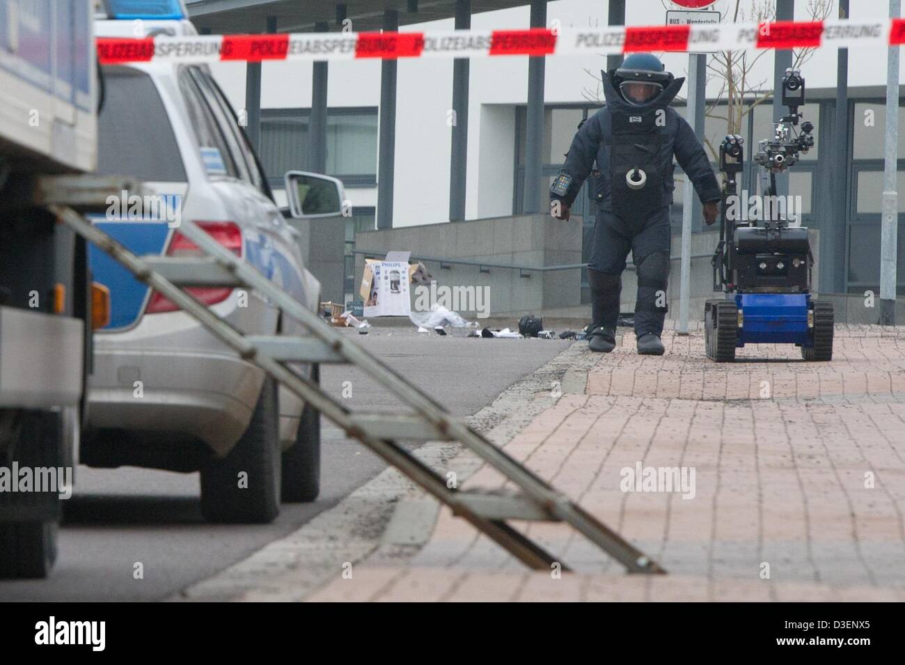 An officer from the improvised explosive device (IED) command kneels ...