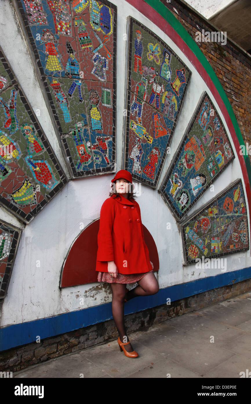 Lady In Red waiting for someone in Brick Lane Stock Photo - Alamy