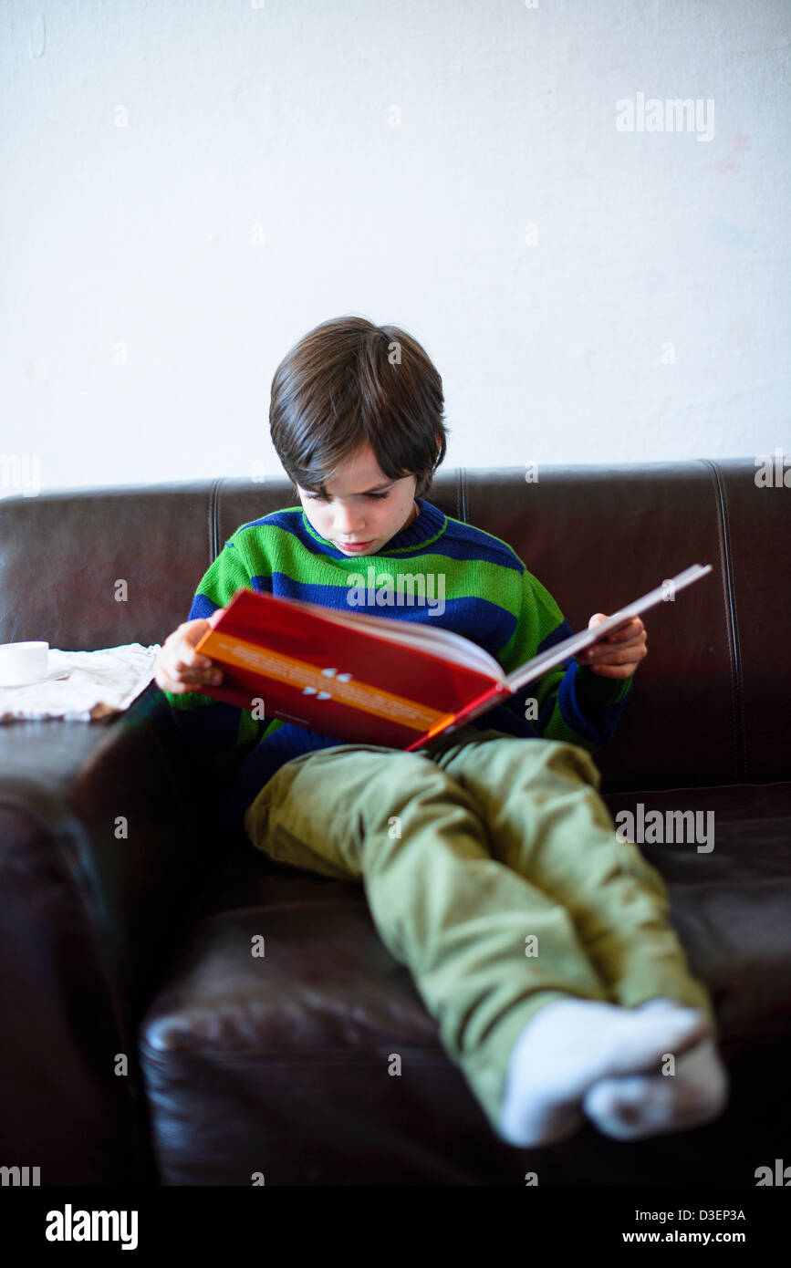 Child reads book sitting hi-res stock photography and images - Alamy