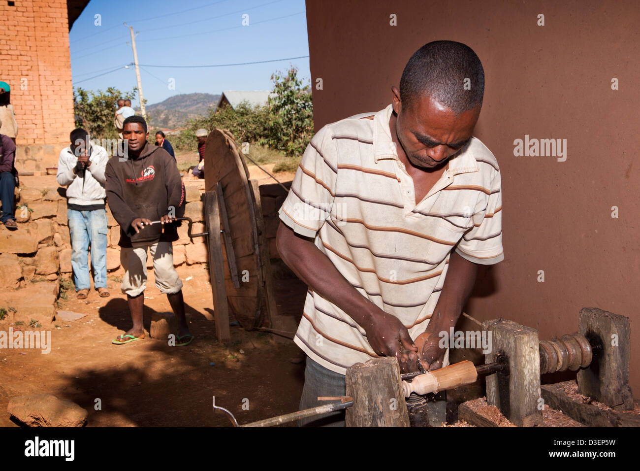 Madagascar, Ambositra, craftsman woodturning on human-powered lathe ...