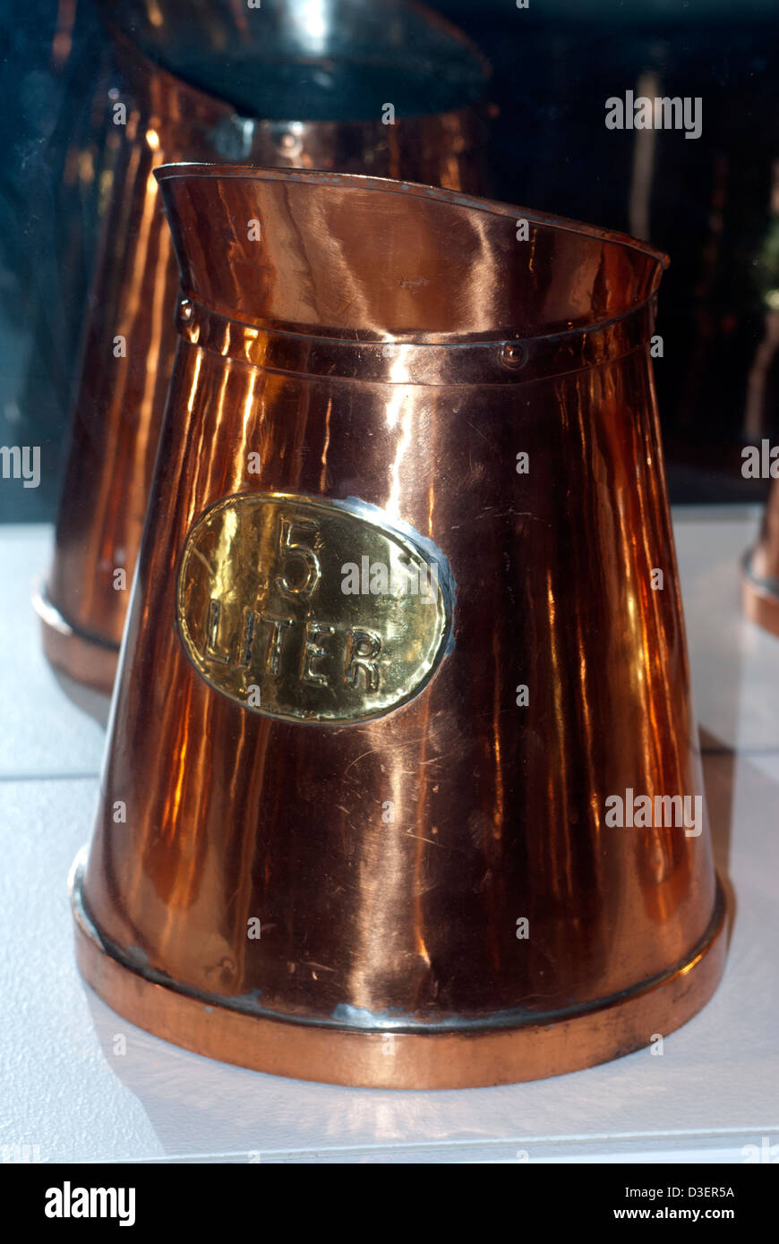 antique brass measuring cup Stock Photo - Alamy