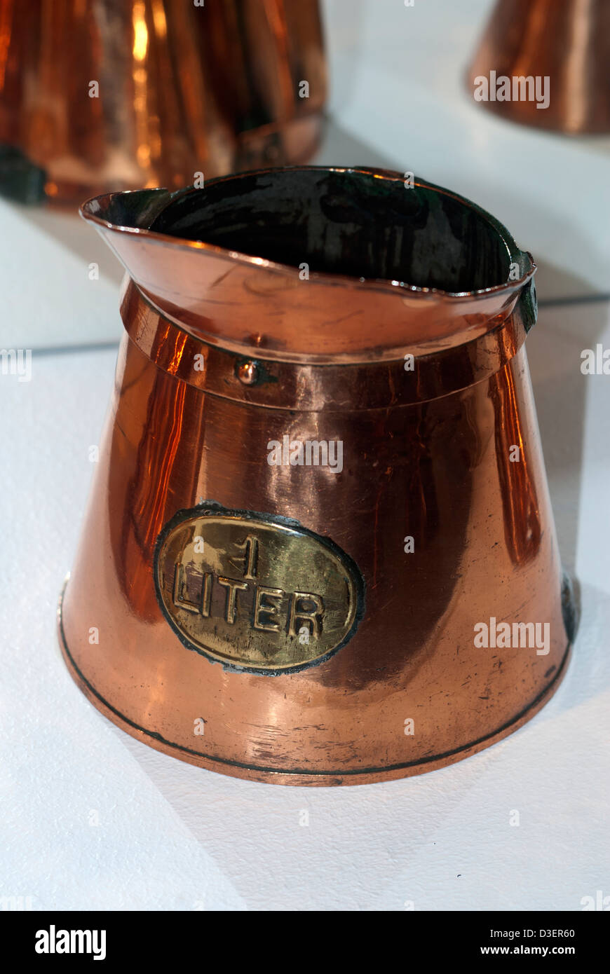 antique brass measuring cup Stock Photo - Alamy