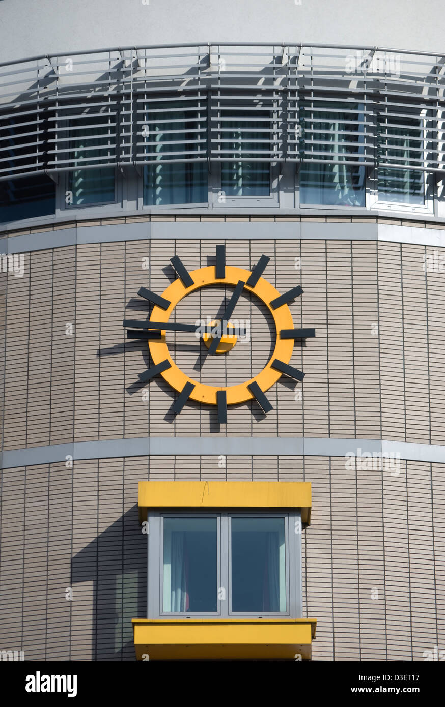 clock face above a window of a modern apartment block in kingston upon ...